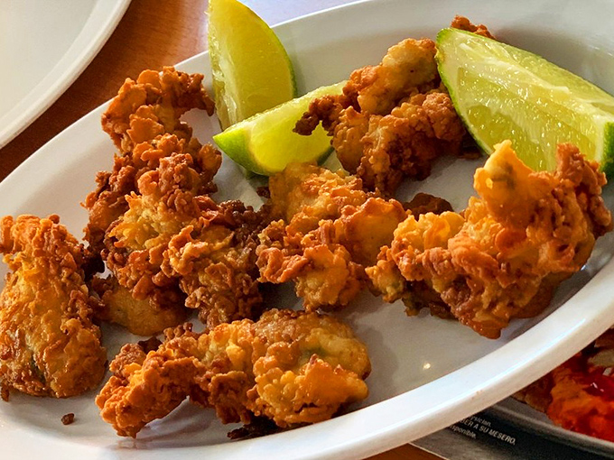 Golden-fried treasures from the deep, these crispy morsels need nothing more than a squeeze of lime. Ocean candy that makes adults giddy as children.