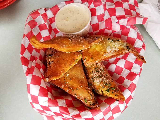 Golden-brown fried pickles offering that perfect trifecta of sour, salty, and crunchy with a cool ranch dip to balance it all.
