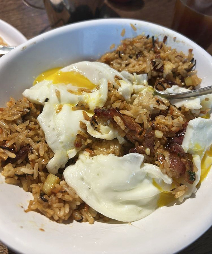 Breakfast fried rice topped with perfectly runny eggs proves that sometimes the best morning innovations come from thinking outside the cereal box.