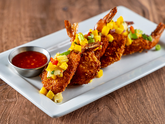 These coconut shrimp aren't just fried&mdash;they're transformed into crispy-sweet treasures topped with tropical salsa that transports you straight to vacation mode.