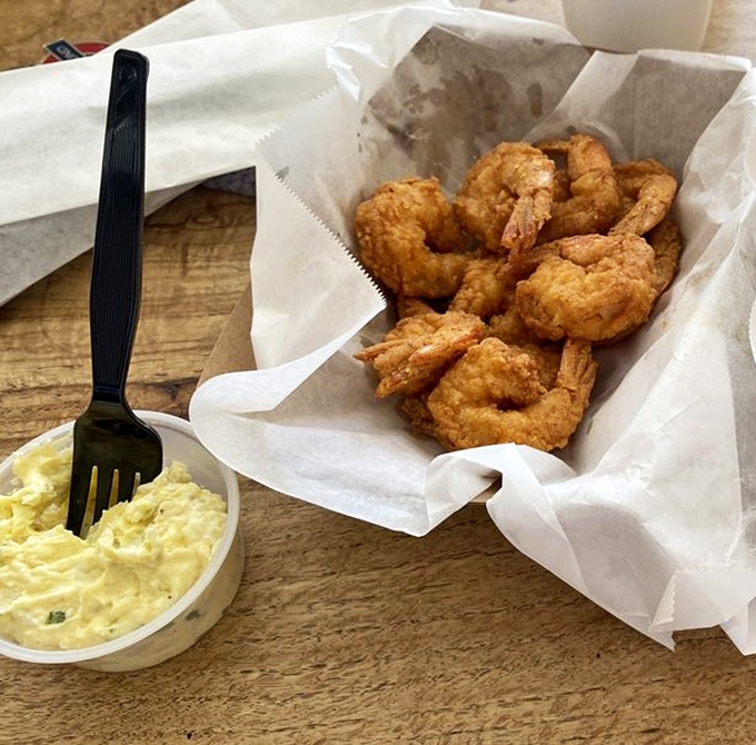These fried shrimp aren't just good&mdash;they're "text your friends immediately" good. Crispy outside, tender inside, with potato salad that deserves its own fan club.