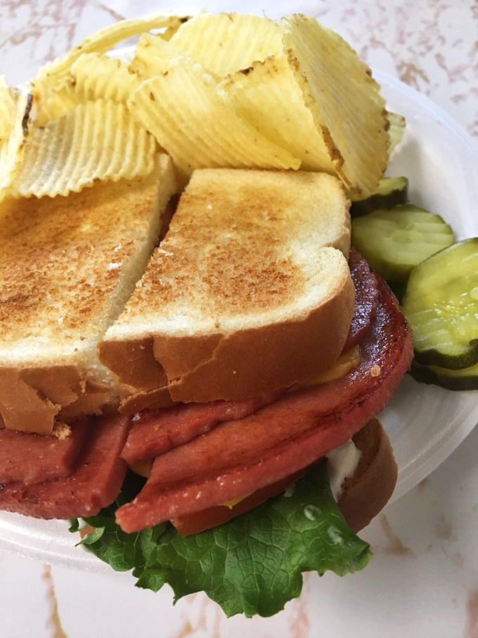 The legendary fried bologna sandwich &ndash; where humble lunch meat gets the star treatment it deserves. Those crispy edges are worth crossing county lines for.