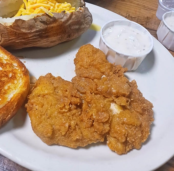 Country fried chicken that could make your grandmother jealous, paired with a loaded potato that's practically a meal itself.