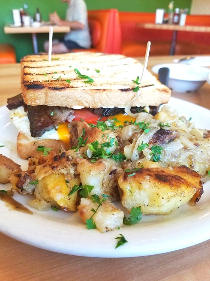 This isn't just breakfast&mdash;it's edible architecture. Crispy potatoes, melted cheese, and a sandwich that demands both hands and your full attention.