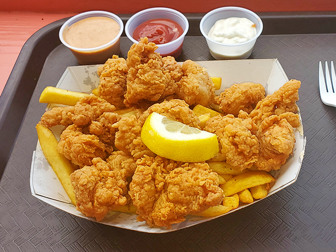 Crispy nuggets of fried goodness that would make even the Colonel jealous, served with a lemon wedge that's not just garnish&mdash;it's essential.