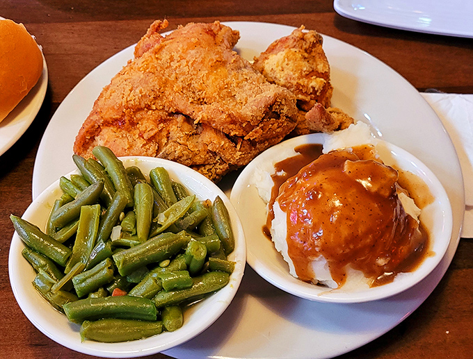 Golden-brown fried chicken that makes a satisfying crunch heard 'round the table, paired with sides that refuse to be upstaged.