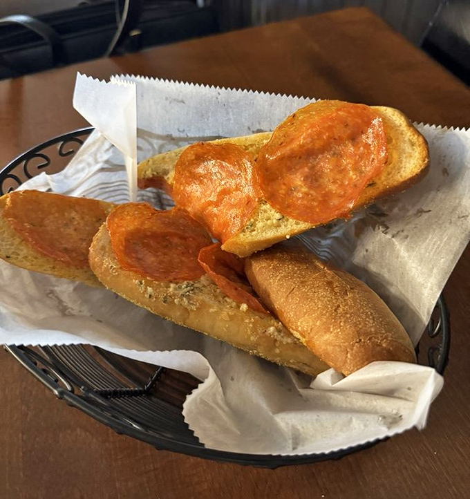 Garlic bread that could ward off vampires from three counties away, yet you'll still lean in for another heavenly, buttery bite.