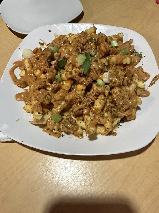 These aren't your average loaded fries&mdash;Gator Fries arrive smothered in cheese, scallions, and yes, actual alligator meat for the adventurous Hoosier.