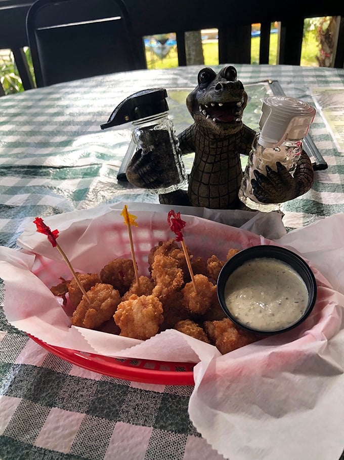 The ultimate Florida appetizer experience: golden-fried gator bites served with a side of irony, as their taxidermied relatives look on.