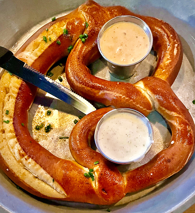 Not your ballpark pretzel! This twisted beauty arrives golden-brown and pillowy-soft, with dipping sauces that elevate the humble pretzel to art form status.