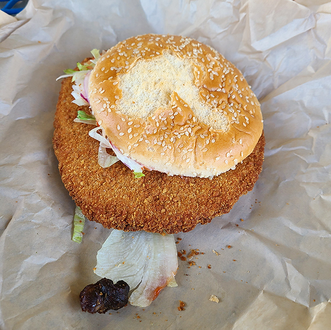 That tenderloin is playing hide-and-seek with the bun, and winning by a country mile.