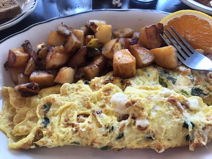 This isn't just breakfast, it's morning therapy&mdash;a Greek omelet with home fries that could solve most of life's problems.