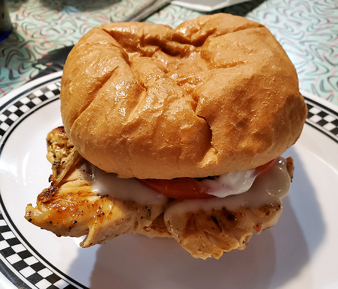 This grilled chicken sandwich arrives looking like it just won first prize at the county fair.