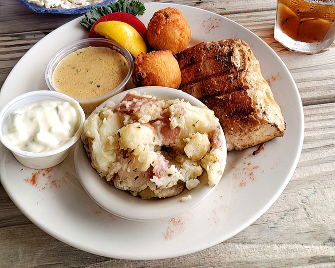 This isn't just grilled fish &ndash; it's a love letter to the sea. Perfectly seared mahi-mahi with potato salad and hush puppies makes for coastal poetry.