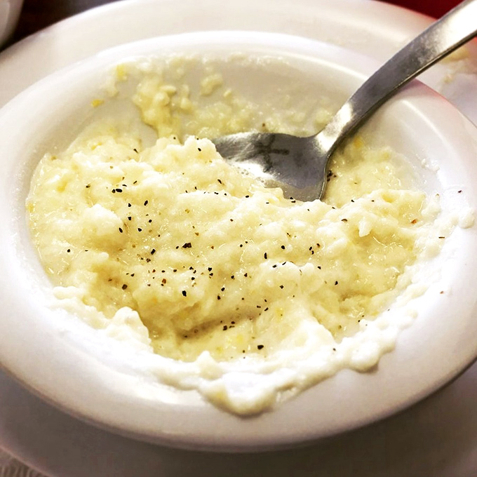 Grits so creamy and perfectly peppered they could convert even the most dedicated Yankees. Southern comfort in a bowl.