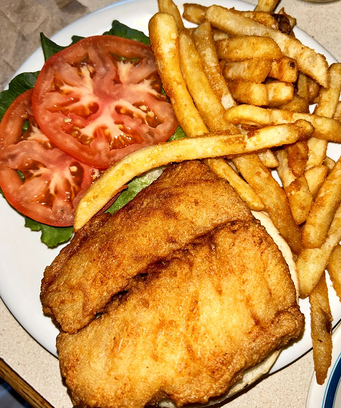 Golden-fried perfection meets garden-fresh tomato. This fish sandwich doesn't need fancy tricks—just honest cooking that lets quality speak for itself.