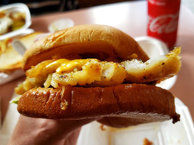 The Grouper Sandwich showcases Florida's coastal bounty with golden-fried fish and melted cheese—a seafood indulgence that rivals the burgers.