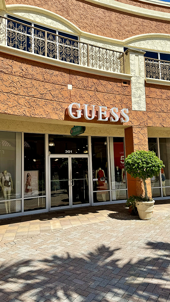 Guess where you'll find European-inspired fashion at Florida prices? Behind these elegant wrought-iron balconies.