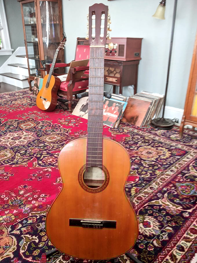 Classical guitars rest on vibrant Persian rugs, waiting for someone to bring their dormant melodies back to life.
