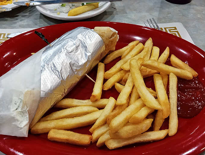 When your gyro arrives wrapped like a silver present with golden fries standing guard, you know you've made excellent life choices today.