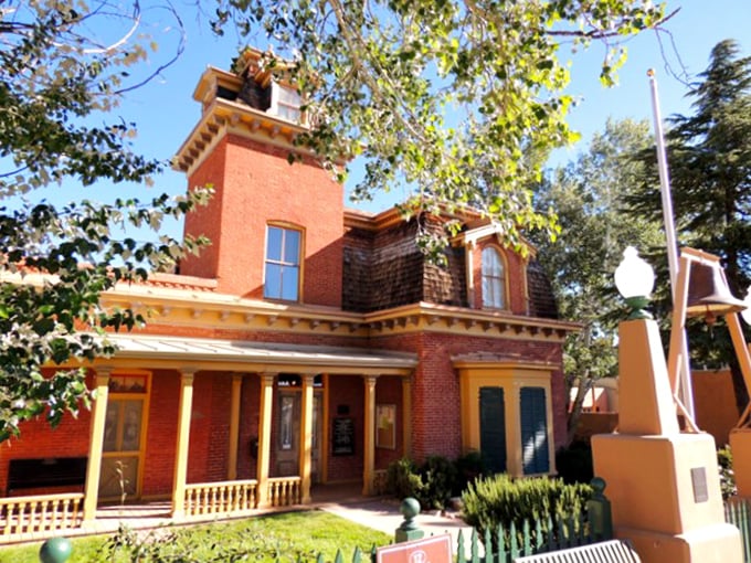 The H.B. Ailman House stands as a Victorian time capsule, its brick facade and ornate details whispering tales of Silver City's mining heyday.