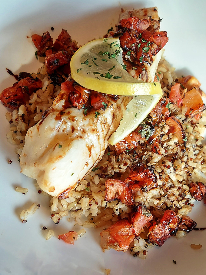 Fish and rice living in perfect harmony, like a culinary Simon and Garfunkel. Those caramelized bits are where the magic happens.