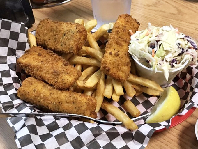 Golden-fried perfection that would make Captain Ahab forget about that whale. Crispy outside, flaky inside&mdash;the seafood trifecta completed with fries and slaw.