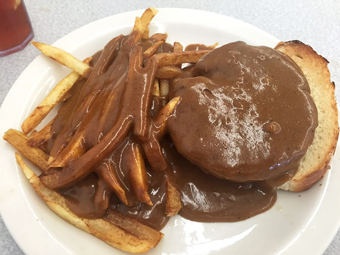Comfort food elevated &ndash; a burger smothered in rich brown gravy alongside perfectly crisp fries. Diet plans, consider yourselves postponed.