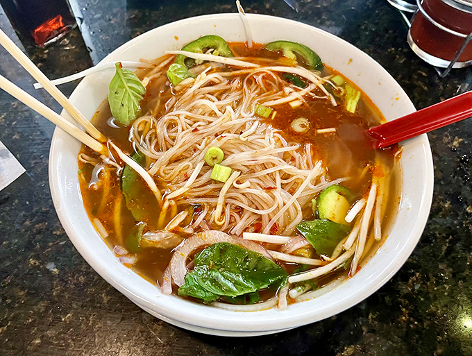 Noodles dancing in broth with vibrant jalape&ntilde;os and basil&mdash;proof that sometimes the most satisfying meals come in liquid form.