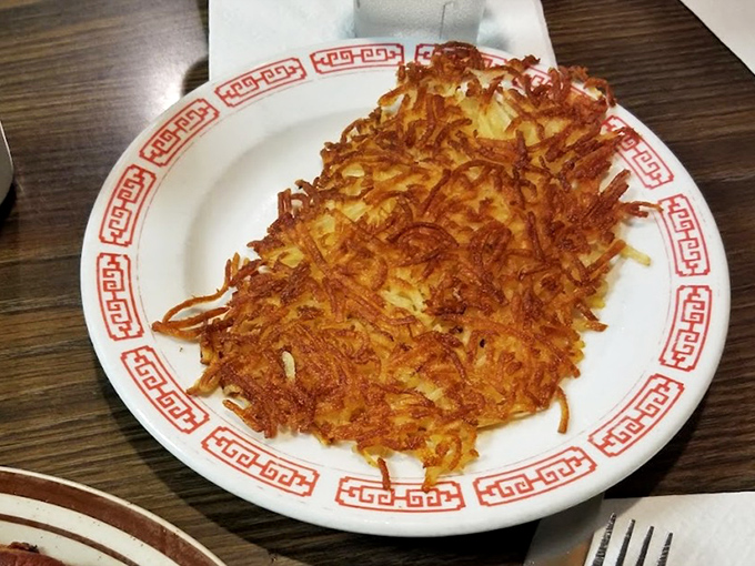 Hash browns that achieve the impossible: perfectly crispy exterior giving way to tender potato within. Pure breakfast alchemy.