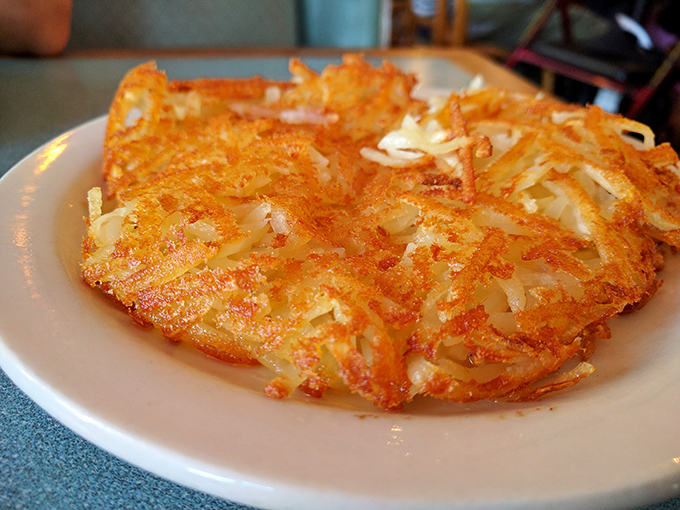These hash browns achieve the impossible trifecta: golden-crispy exterior, tender inside, and enough surface area to soak up every last drop of egg yolk.