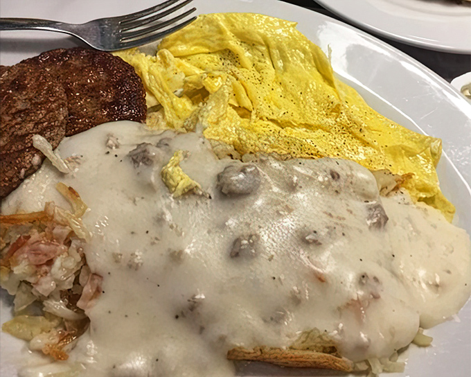 Breakfast heaven on a plate&mdash;fluffy eggs, crispy hashbrowns, and a sausage gravy that could make a vegetarian reconsider.
