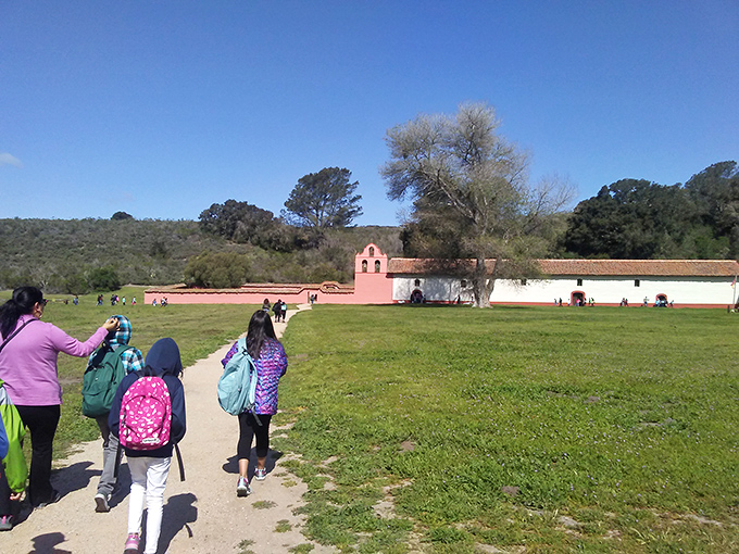 History comes alive as families explore the grounds of La Purisima Mission. Pink adobe walls tell stories that textbooks can't capture.