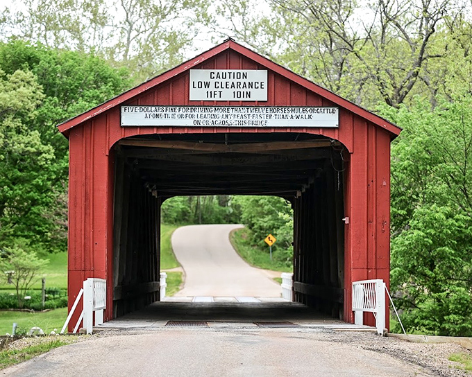 This red covered bridge isn't just picturesque &ndash; it's practically demanding you slow down and appreciate the craftsmanship of a bygone era.