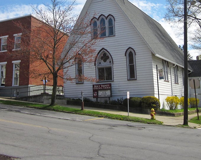 Holy Trinity Episcopal Church offers both spiritual sanctuary and architectural charm with its distinctive Gothic windows and white clapboard simplicity.