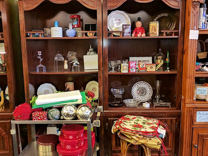 Wooden cabinets showcase holiday treasures and collectibles that once graced someone else's mantel, now ready for yours at a fraction of retail.