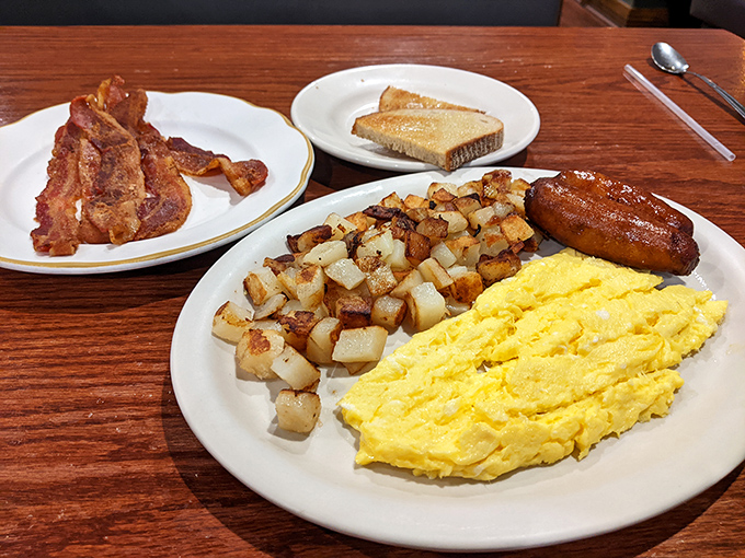 Breakfast alchemy at its finest&mdash;fluffy scrambled eggs, golden home fries, and sausage links that snap with that satisfying first bite.