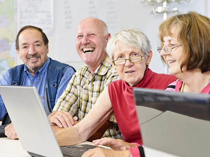 Technology workshops bring residents together, proving you're never too experienced for a good laugh while navigating the digital world.