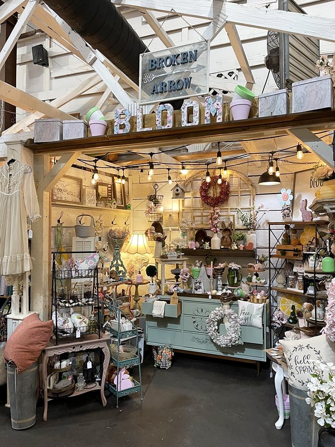 The "Broken Arrow Bloom" booth showcases farmhouse chic at its finest, where vintage furniture meets modern styling in perfect harmony.