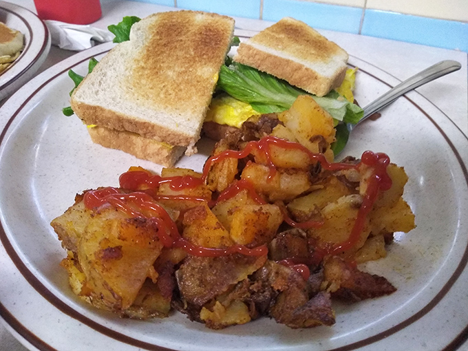 Home fries with edges so crispy, they practically sing when your fork hits them – pure potato perfection.
