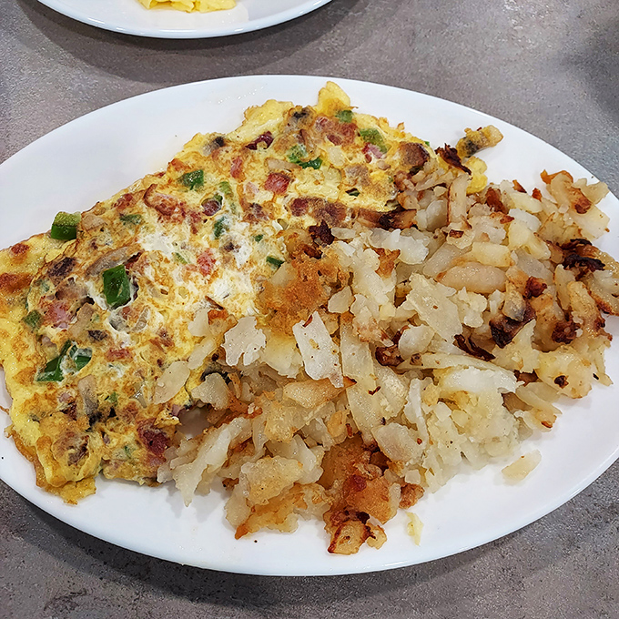 This western omelet and home fries combo is the breakfast equivalent of hitting all green lights on your morning commute.