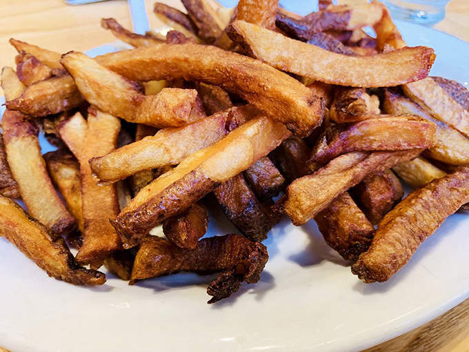 These aren't just fries; they're golden potato wands that have been blessed by the crispy gods of comfort food.
