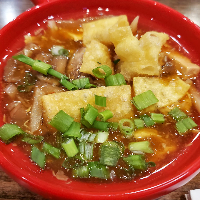 This hot and sour soup isn't just comfort in a bowl&mdash;it's a spicy, tangy symphony with crispy tofu islands and green onion confetti.