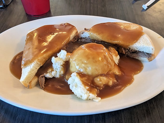 The hot beef sandwich: where gravy isn't just an addition, it's a commitment. Comfort food that hugs you from the inside out.