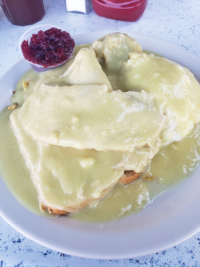 The hot turkey sandwich&mdash;Thanksgiving's greatest gift to everyday dining&mdash;swimming in gravy so good you'll want to request a snorkel with your napkin.