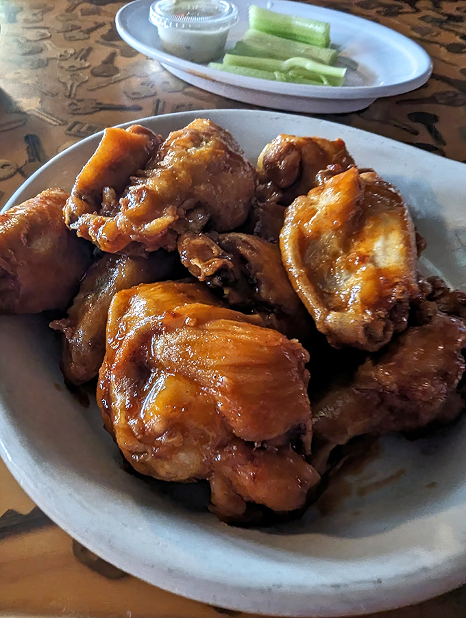 These wings aren't messing around. Glistening with sauce and stacked like delicious dominoes, they're the kind of appetizer that silences conversation at the table.