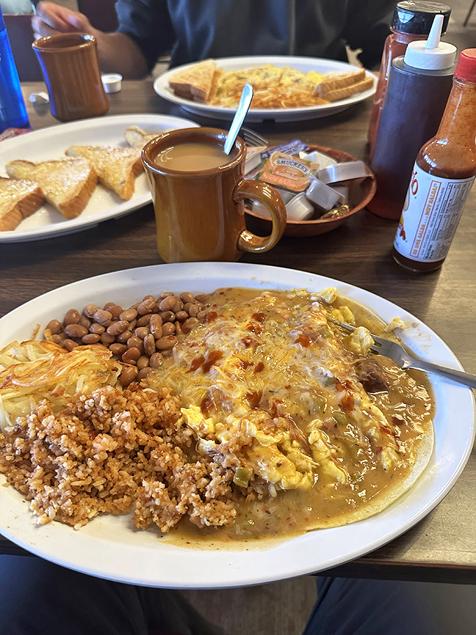 This isn't just breakfast&mdash;it's a Southwest symphony on a plate. Rice, beans, eggs, and that green chile sauce that makes everything better.
