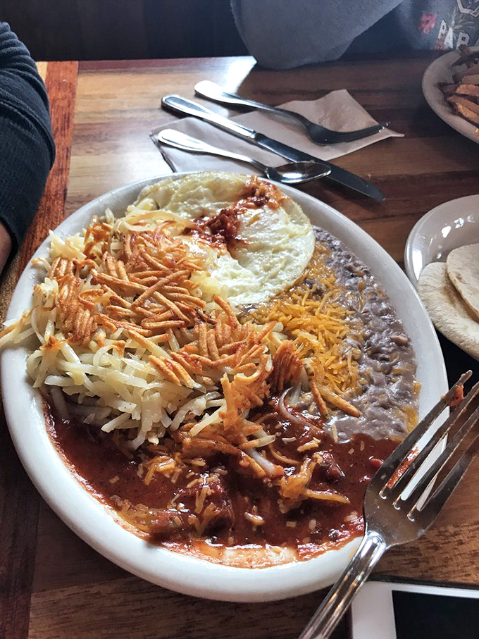 This isn't just Mexican breakfast&mdash;it's a fiesta of flavors with melted cheese, savory beans, and crispy hashbrowns playing supporting roles.