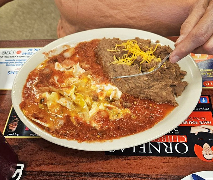 Huevos rancheros that deliver a fiesta of flavors. The perfect marriage of eggs, sauce, and beans &ndash; like a Southwestern symphony on a plate. 