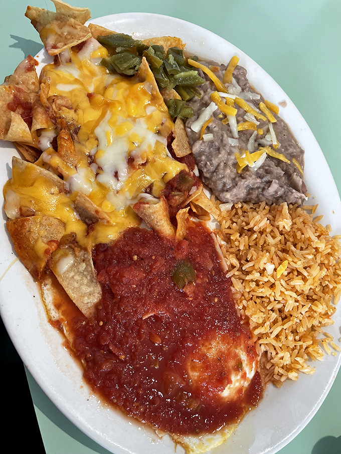 Mexican breakfast magic that would make your abuela proud. Cheese-smothered nachos, refried beans, and Spanish rice create a fiesta of flavors that crosses borders and satisfies souls.